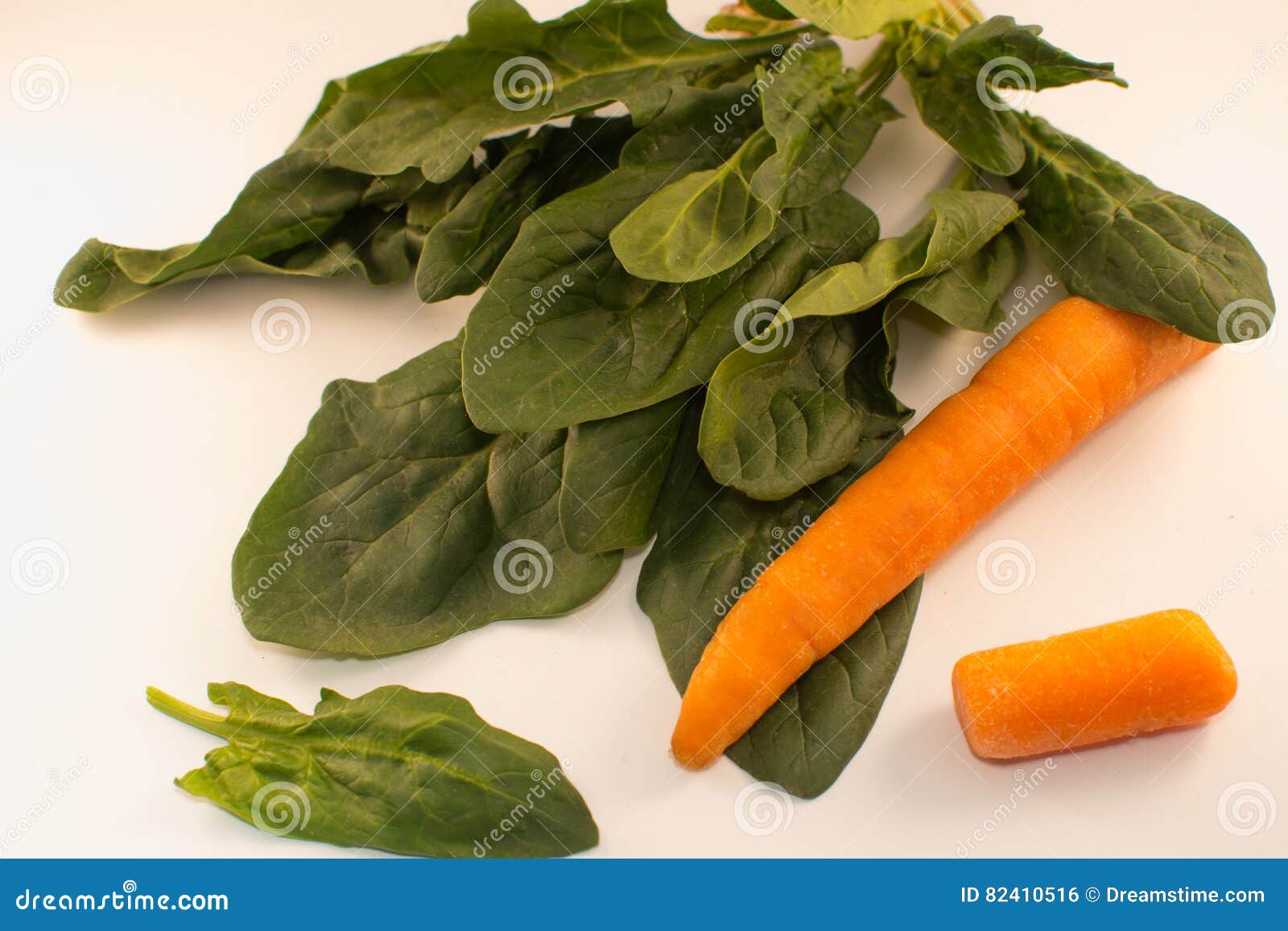 Carrots and Spinach on a White Background Stock Photo - Image of ...