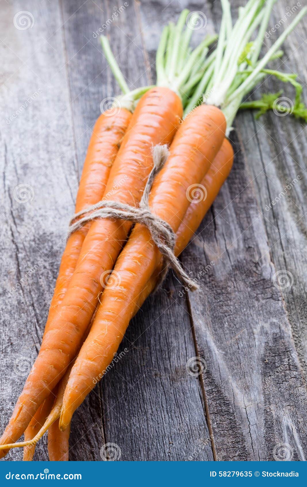 Carrots on a Wooden Table stock image. Image of natural - 58279635