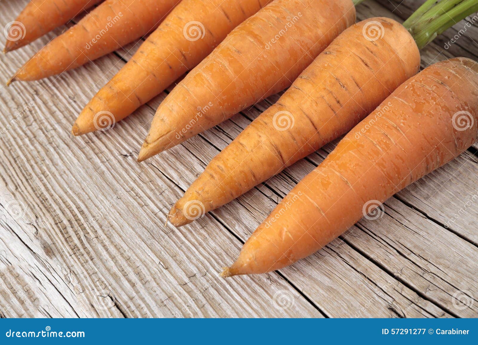 Carrots on wooden table stock image. Image of rustic - 57291277