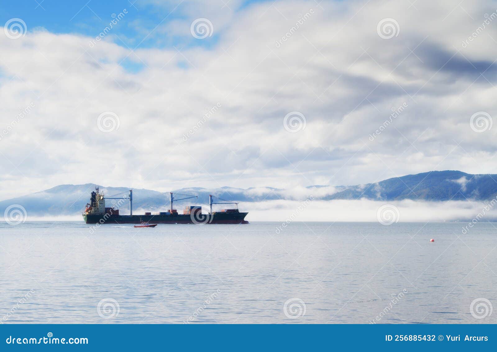 Carrying Valuable Cargo. a Freight Ship Travelling Along the Coast Line ...