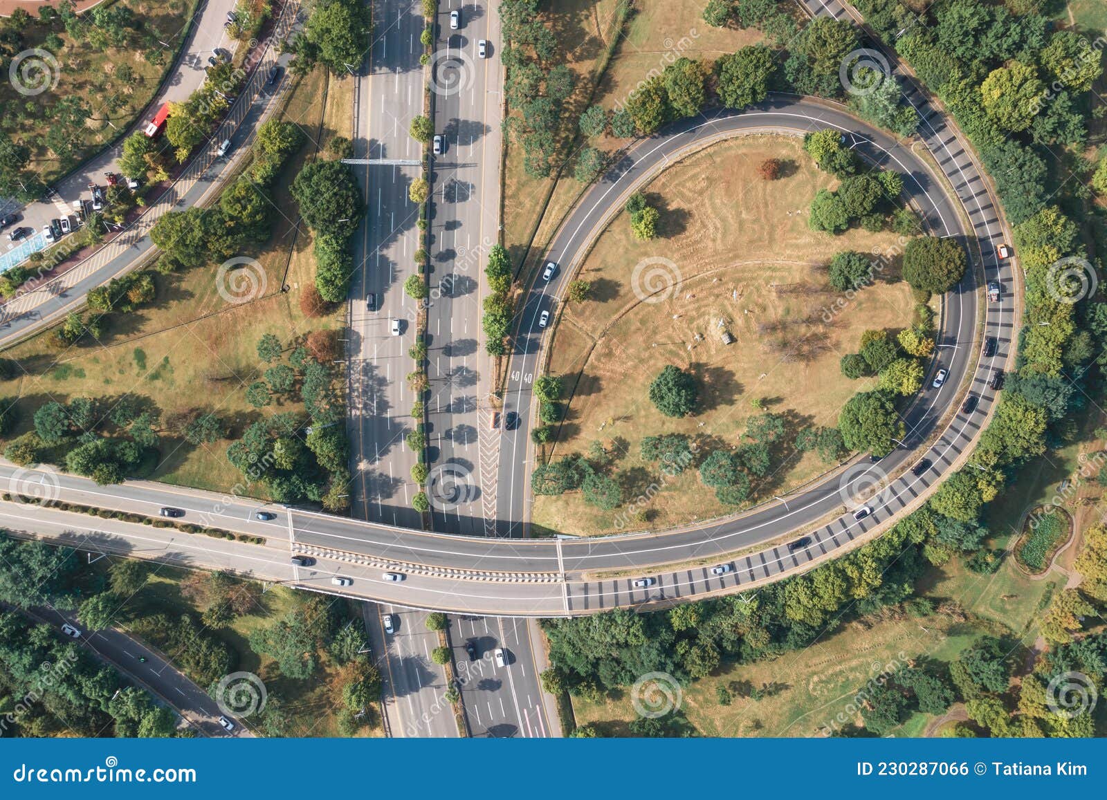Cars Drive Along Loop Shaped Road Junction Top View. Stock Photo ...