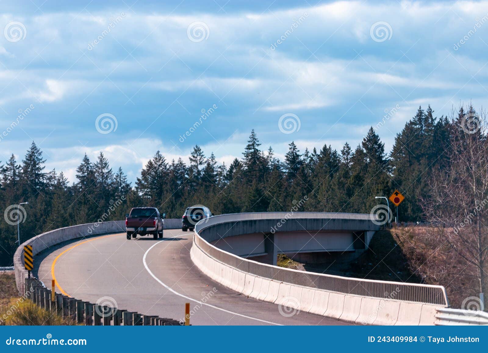 Cars Going Up Over an Interchange on a Freeway in Summer Stock Photo ...