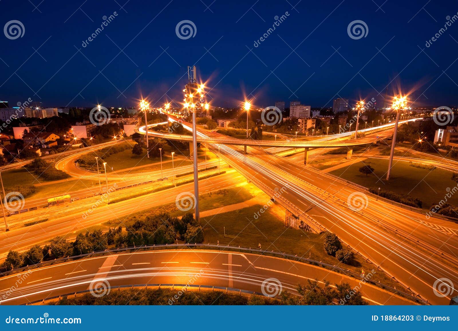 Cars Moving through Highway Intersection at Dusk Stock Image - Image of ...