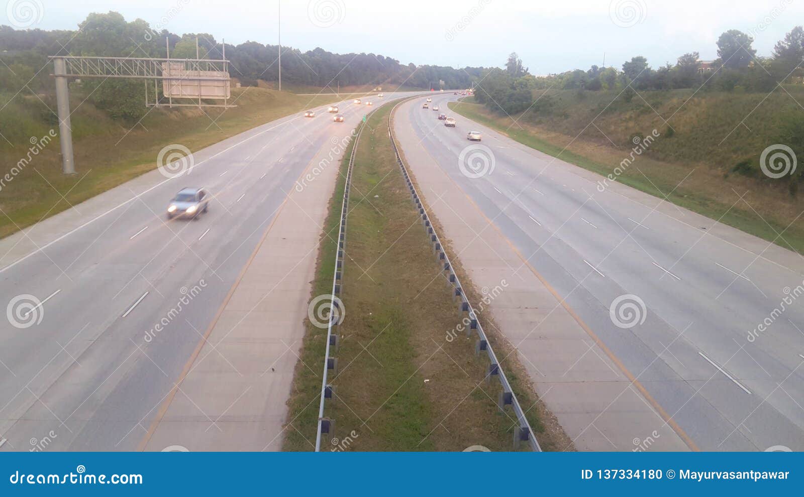 Cars Passing by on an Highway Road Stock Photo - Image of building ...
