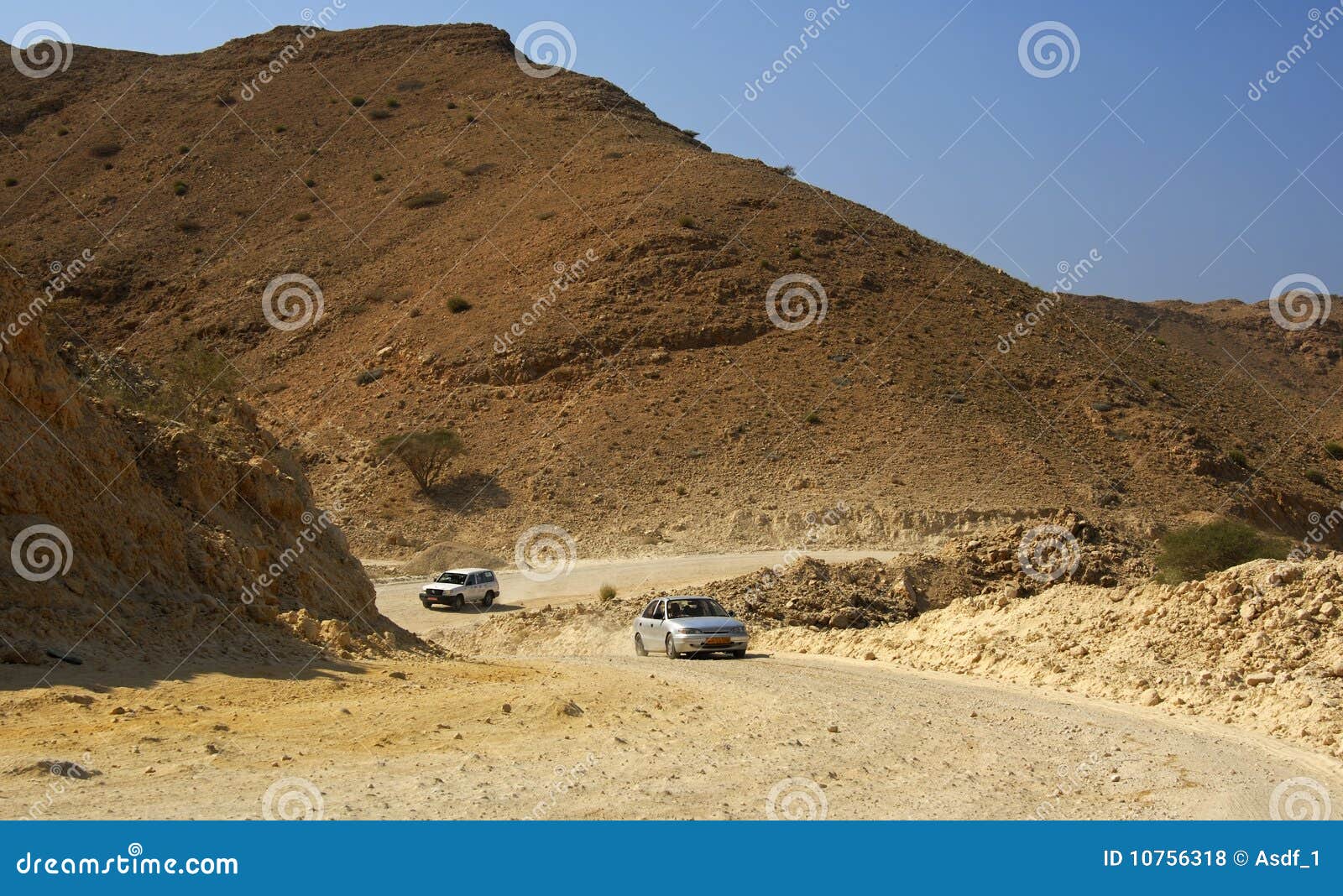 Cars on a Rocky Rough Road in a Wadi Stock Photo - Image of areas ...