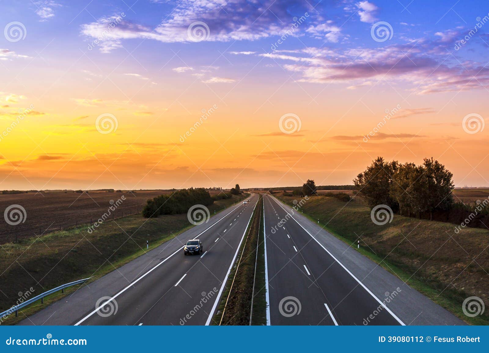 Cars speeding on a highway stock photo. Image of dynamic - 39080112