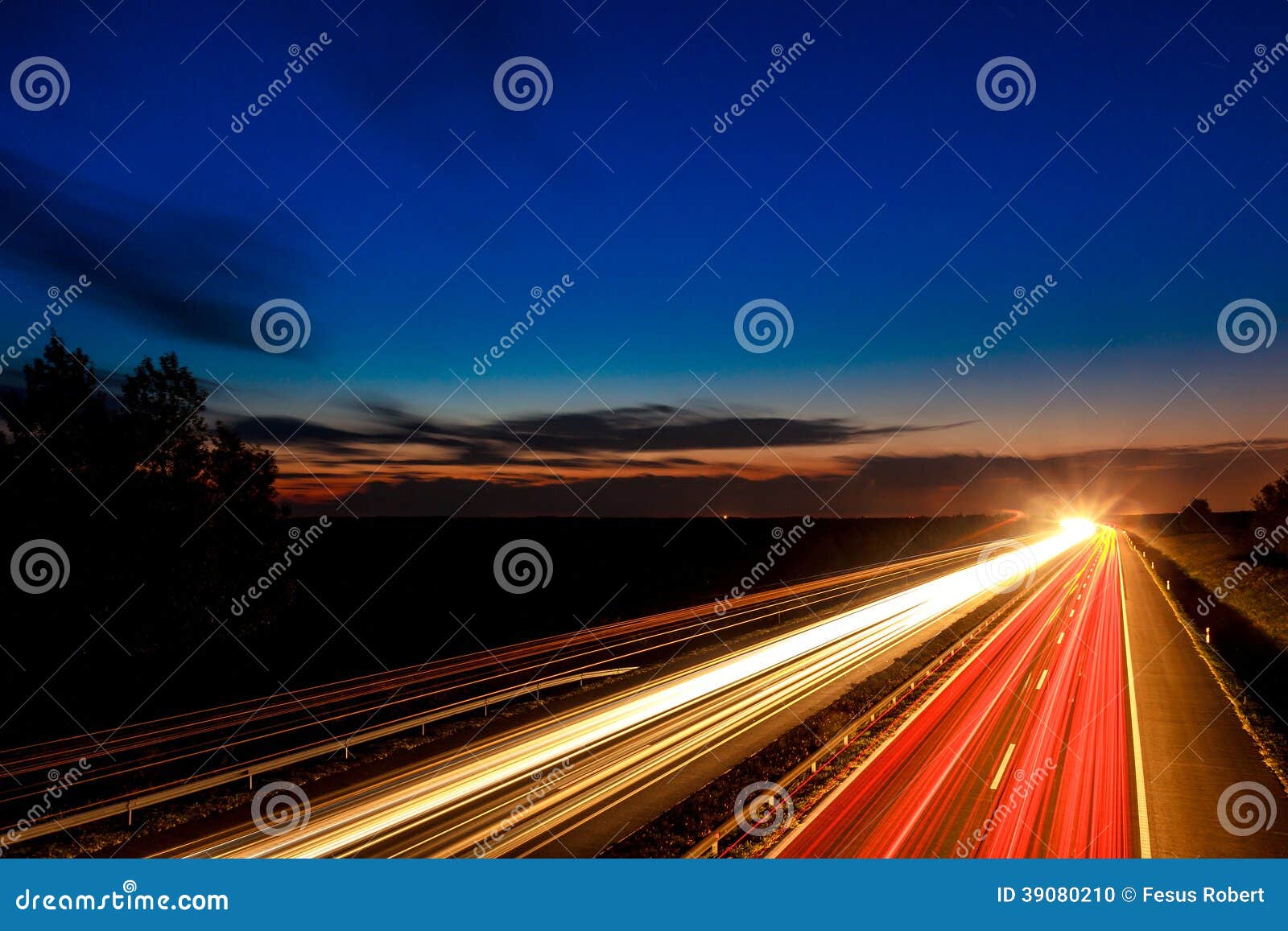 Cars speeding on a highway stock photo. Image of dusk - 39080210