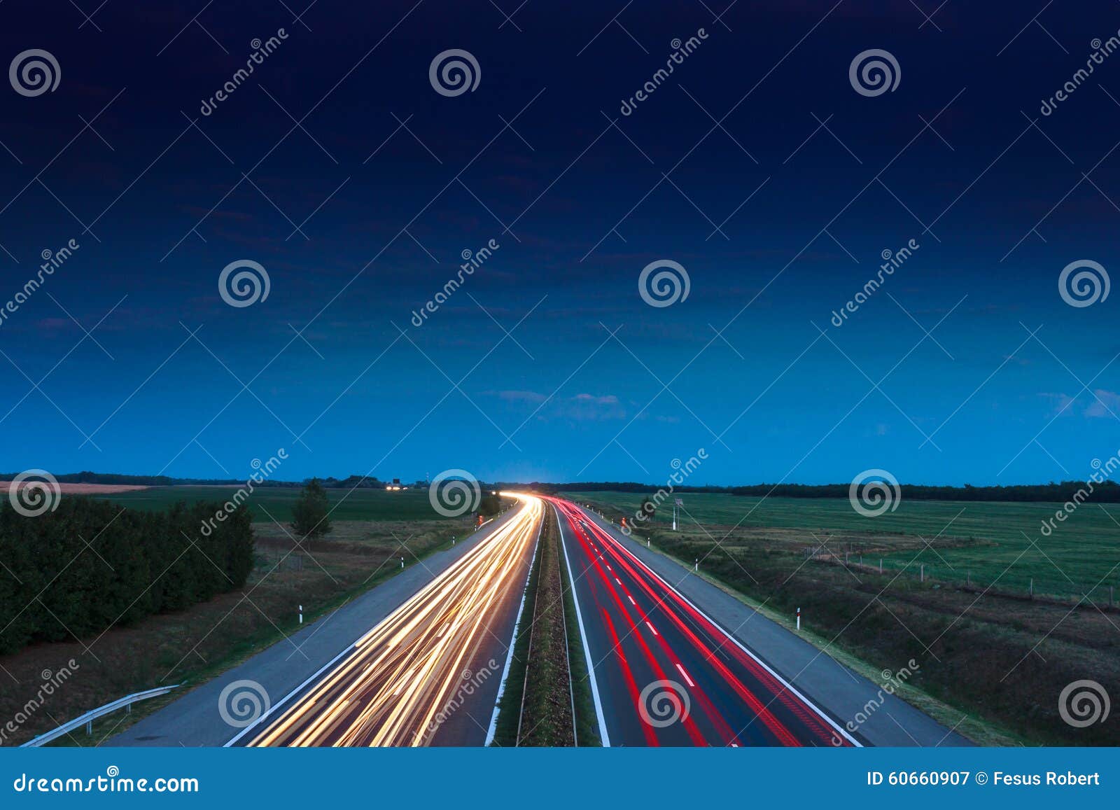 Cars speeding on a highway stock image. Image of motorway - 60660907