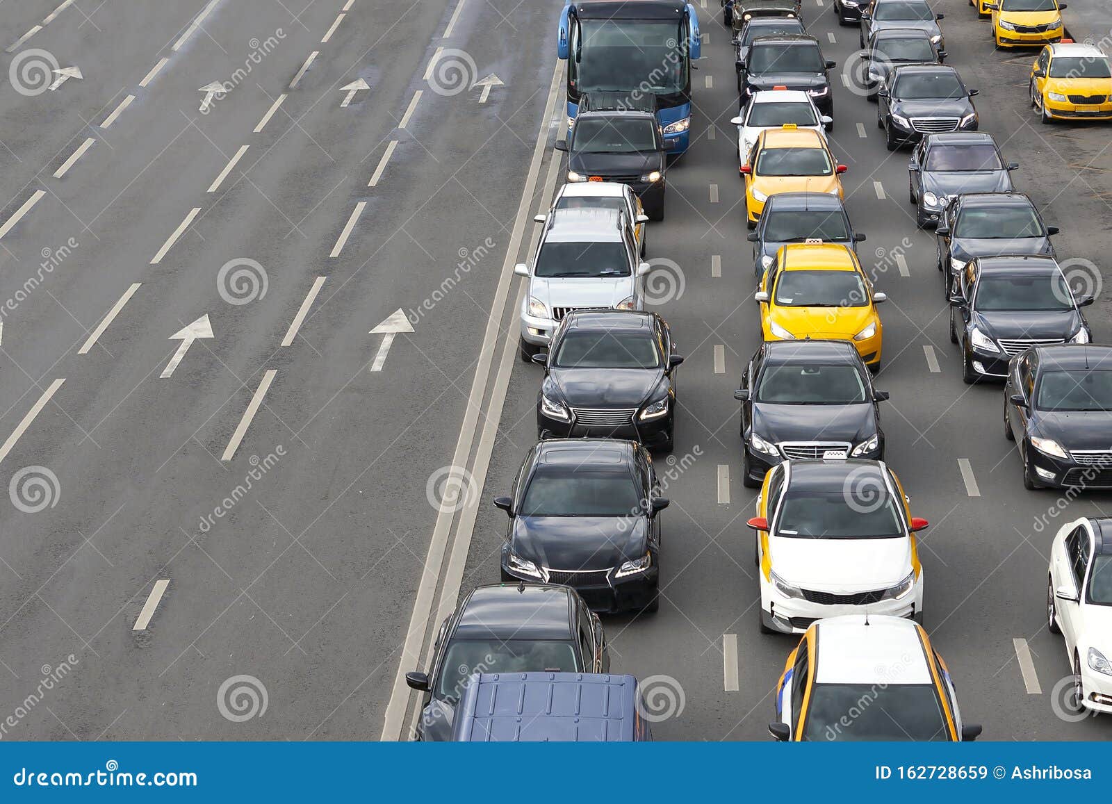 Cars Standing in a Traffic Jam on One Side of a Busy Highway ... Cars Standing in a Traffic Jam on One Side of a Busy Highway ...