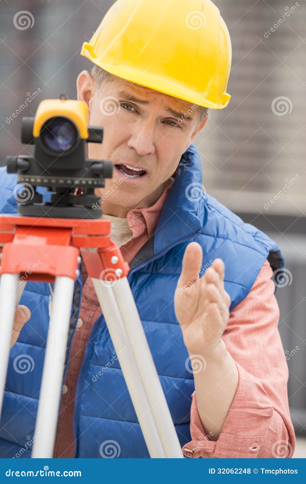 Cartographer Gesturing while Using Theodolite Stock Photo - Image of ...