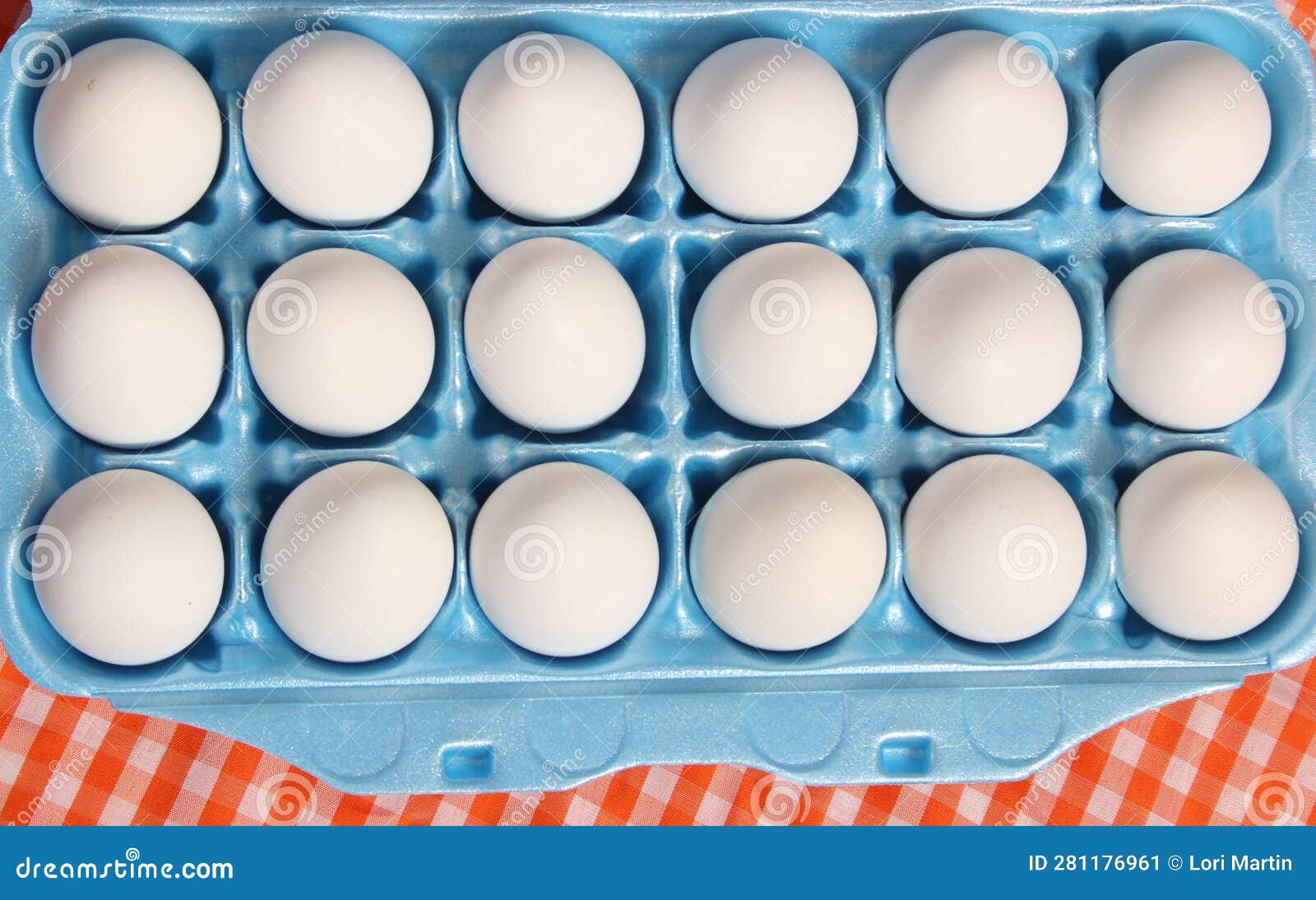 Carton of Eggs on Rustic Table with Checkered Table Cloth Stock Image ...