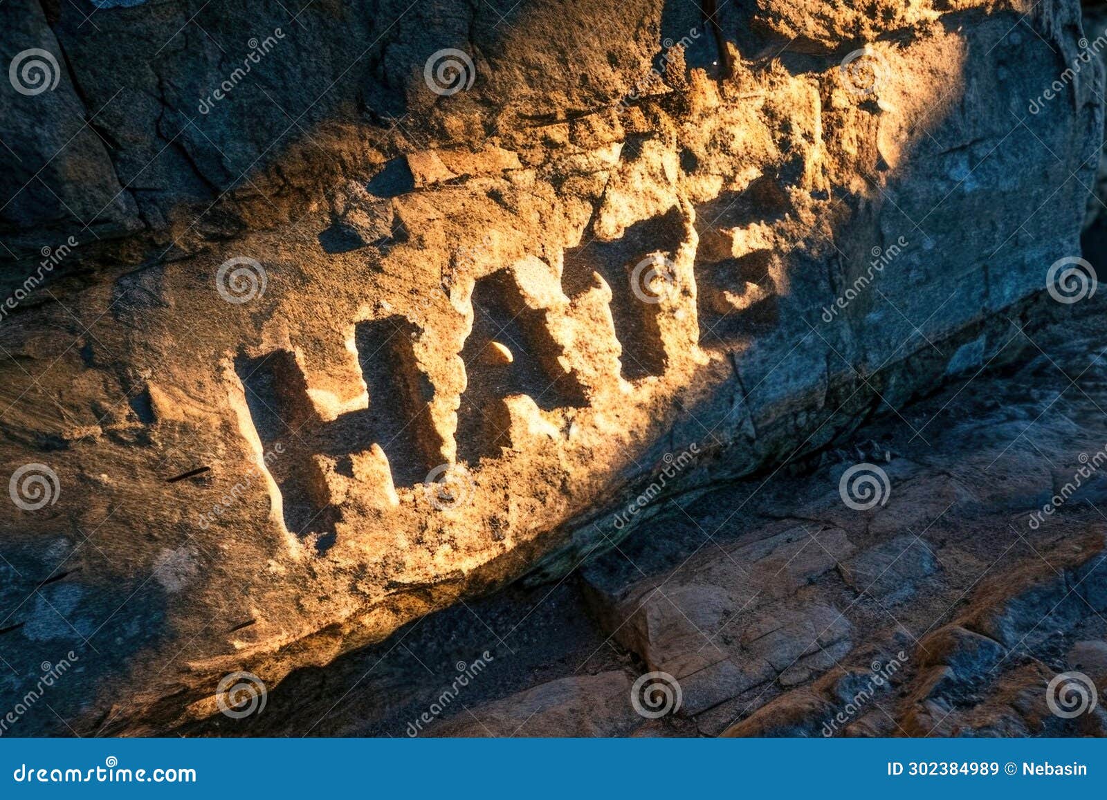 Carved Deep into Stone, the Word HATE Remains Indelible Stock Image ...
