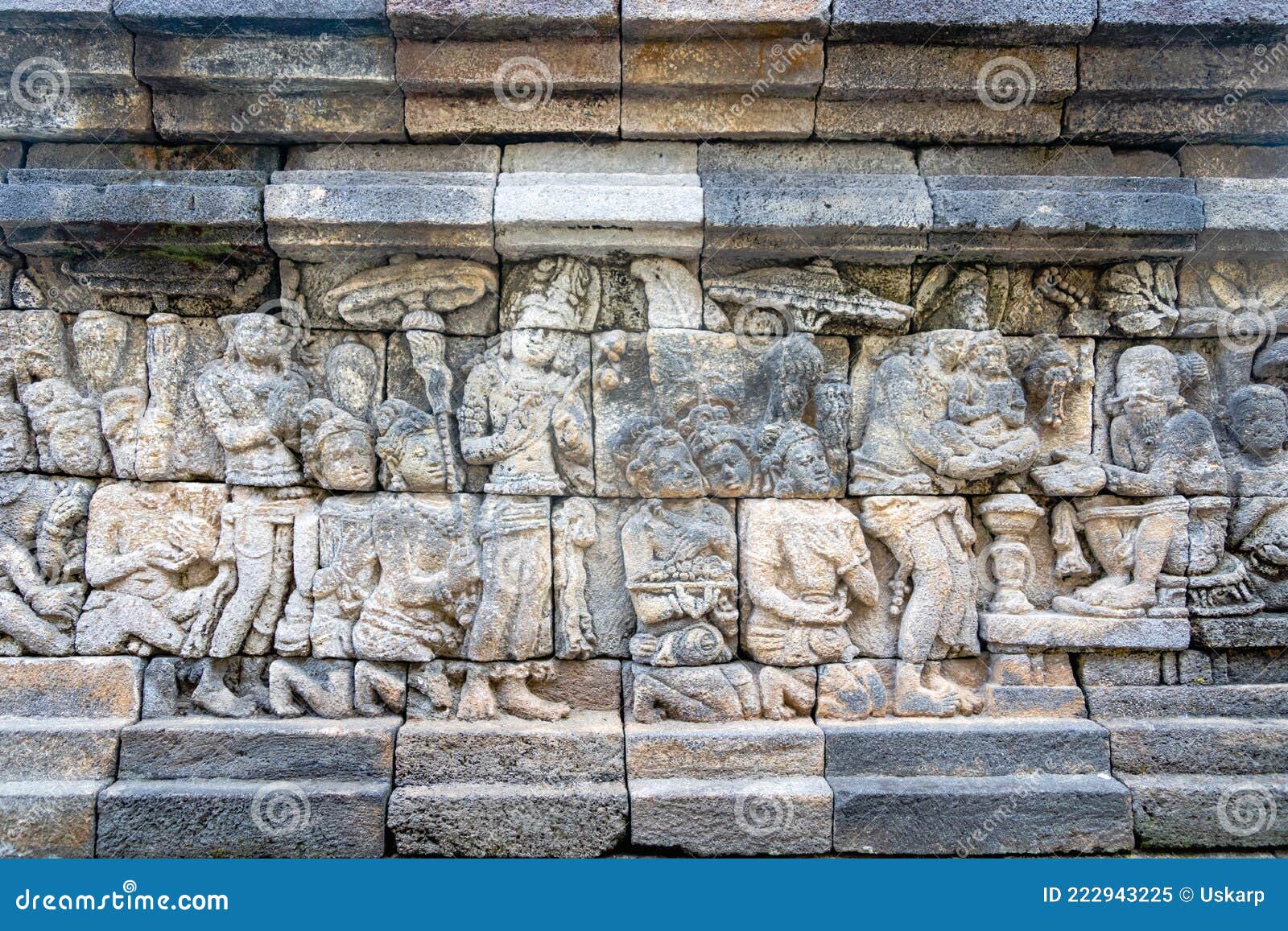 Carved Relief at Borobudur on Java Indonesia. Borobudur is a Buddhist ...