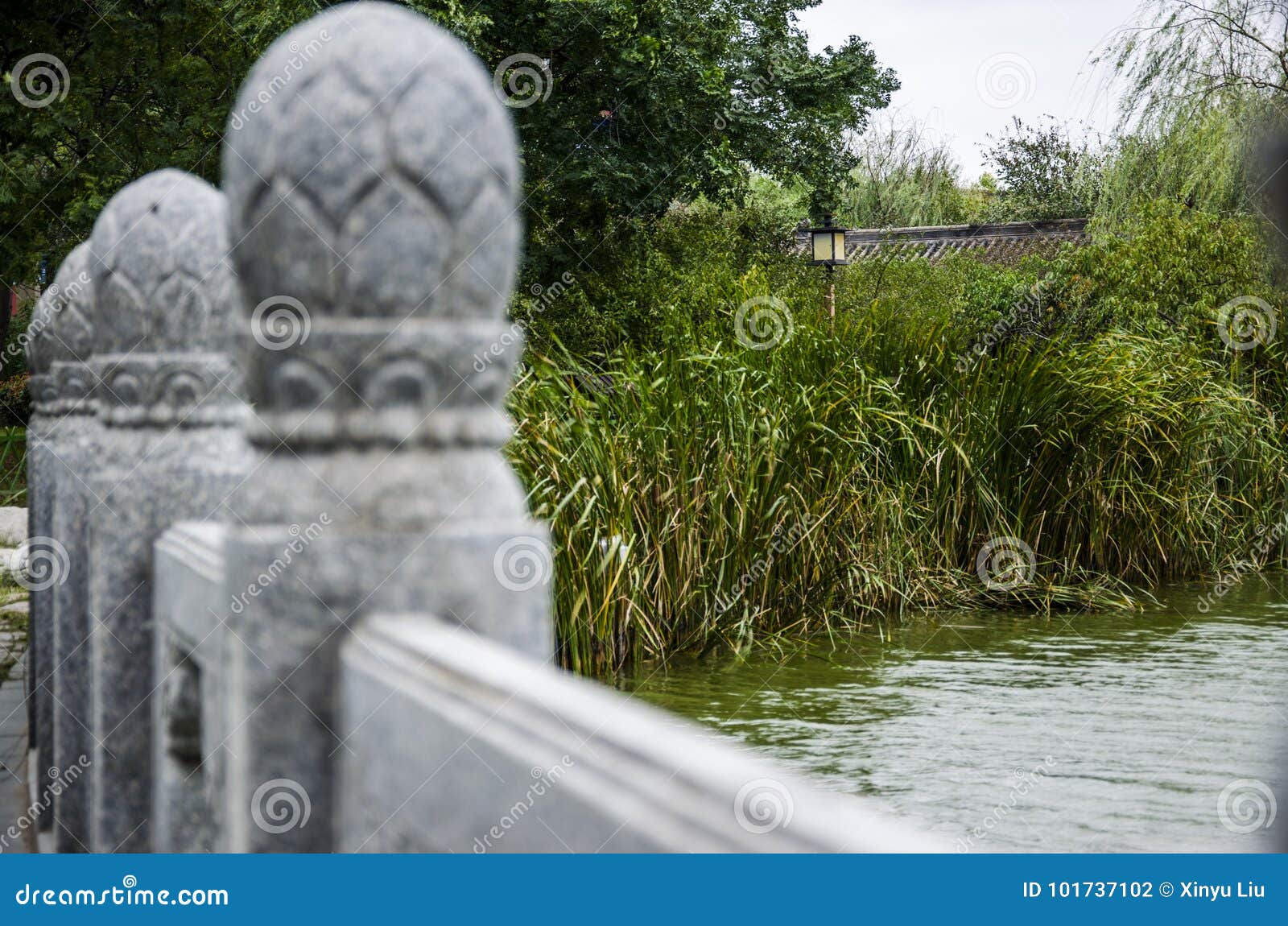 Carved stone pillars stock photo. Image of lake, tree - 101737102