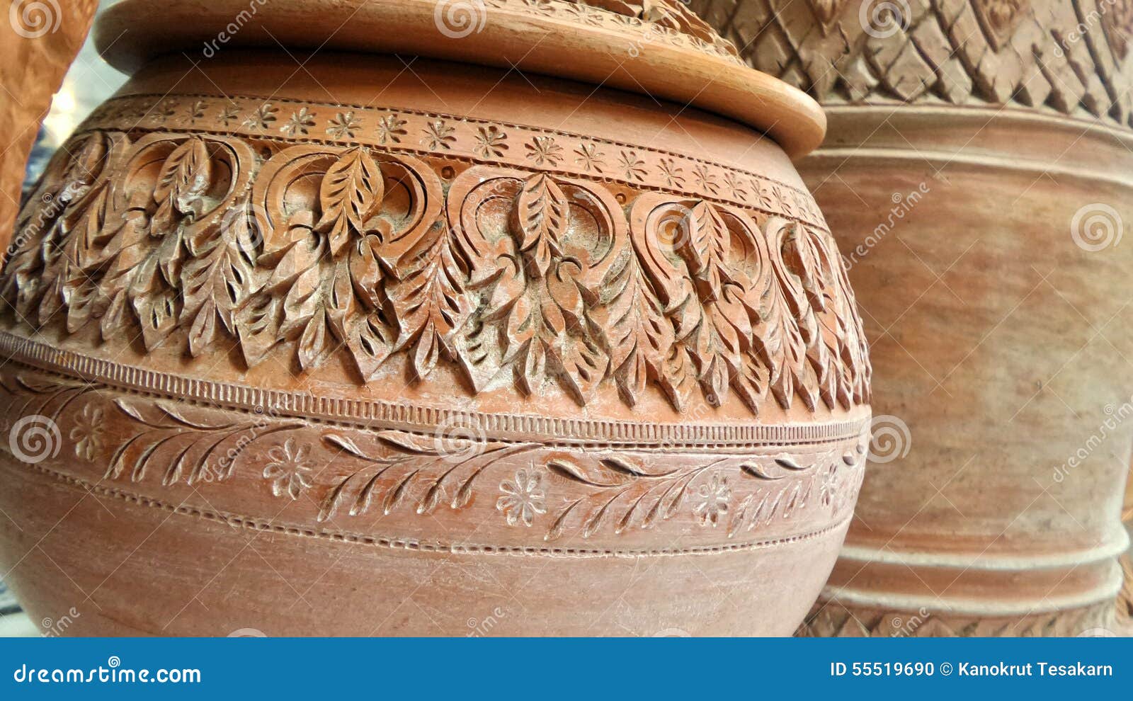 Carving on clay water jar stock photo. Image of caeving - 55519690