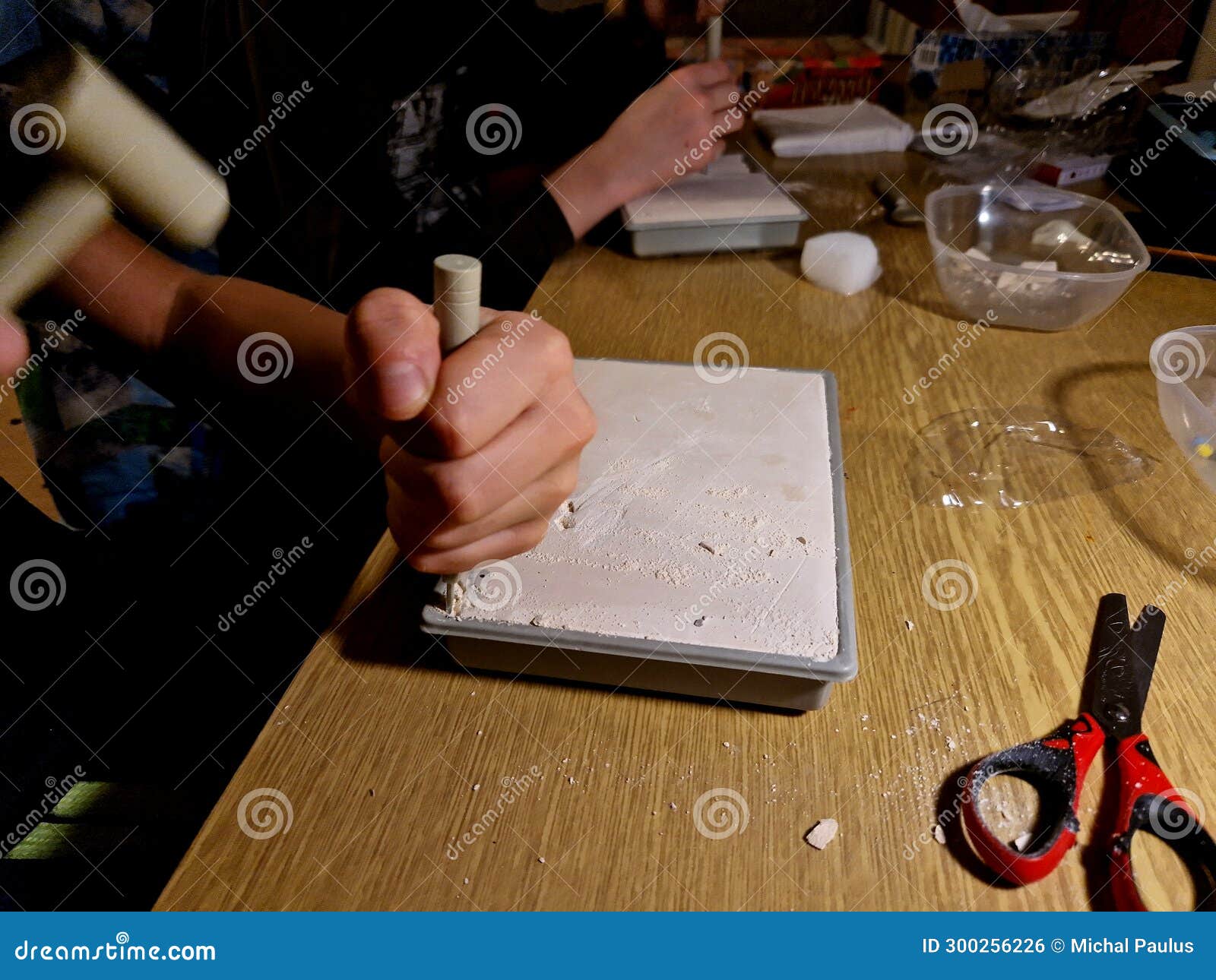 Carving into Plaster with a Chisel is an Art Technique. Bones are ...