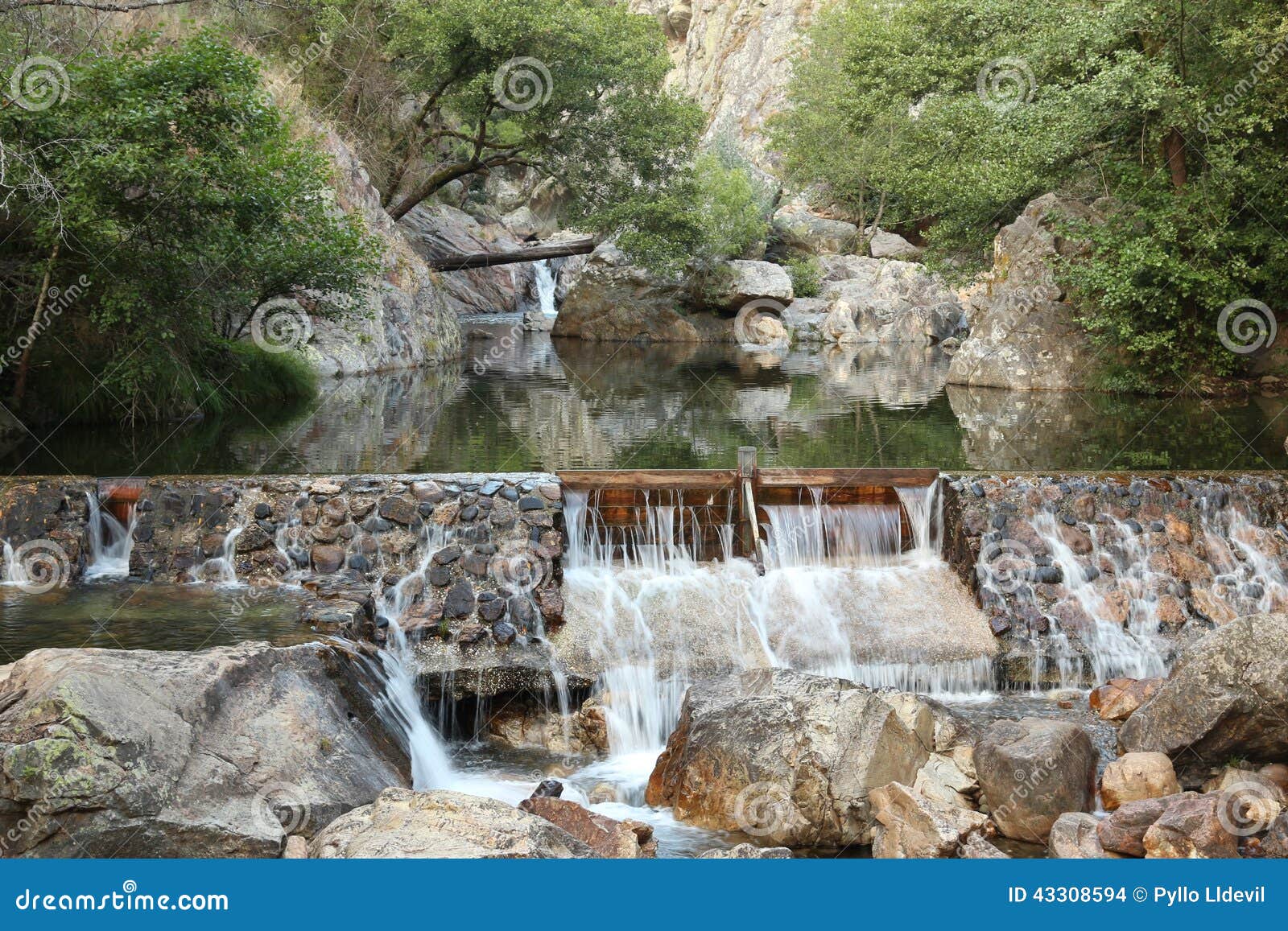 Cascade in a deep valey stock photo. Image of black, pebbles - 43308594