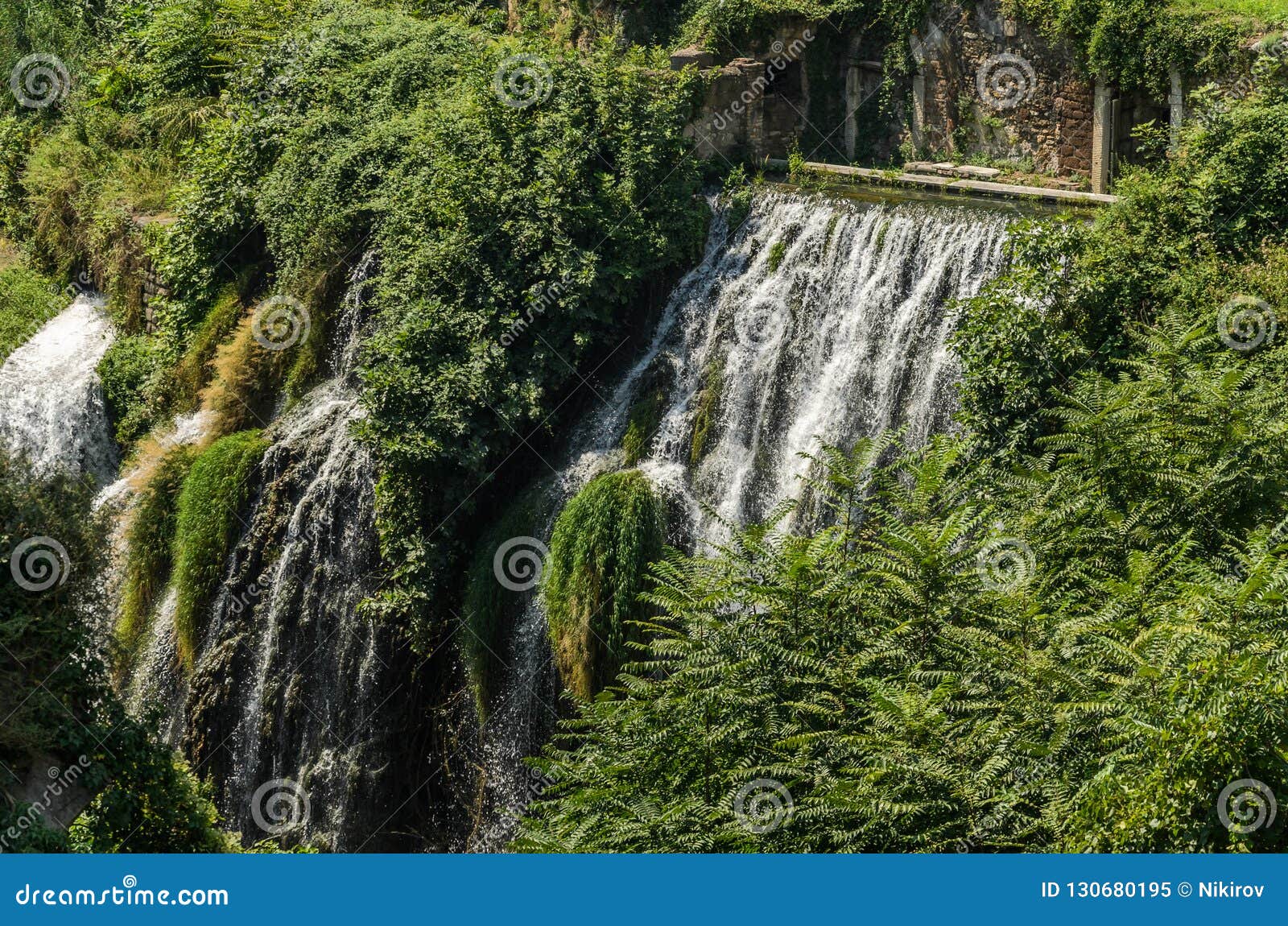 Cascades of Waterfalls among Ancient Ruins in Vegetation Stock Image ...