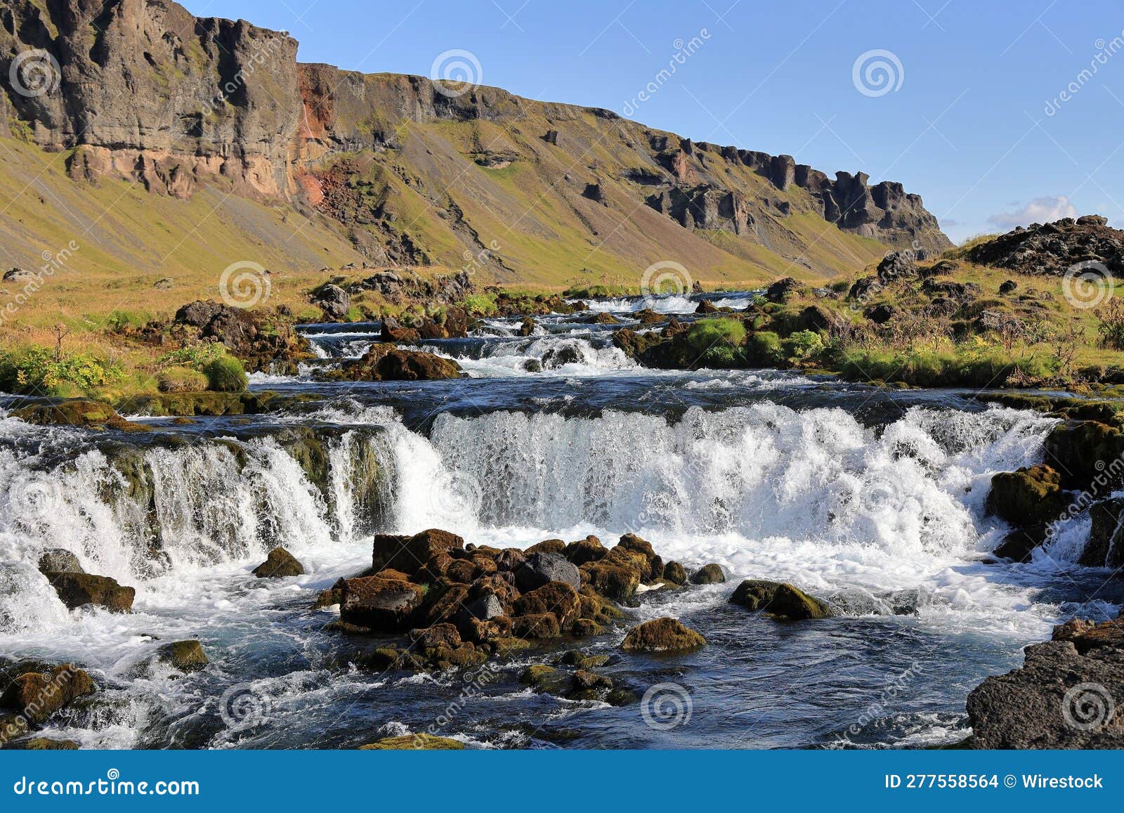 Cascading Stream of Pristine Water Flows Around Large Rocks in a ...
