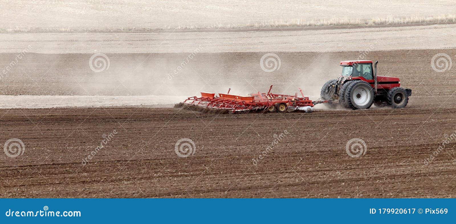 A Case International Tractor Pulling a Plowing Implement, Plows an ...