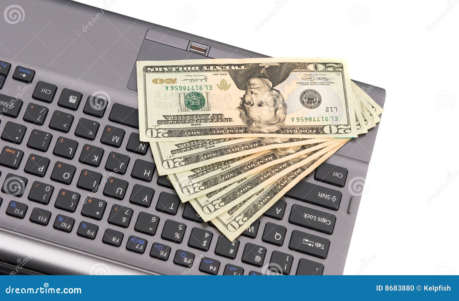 Cash on laptop keyboard. stock photo. Image of communication - 8683880