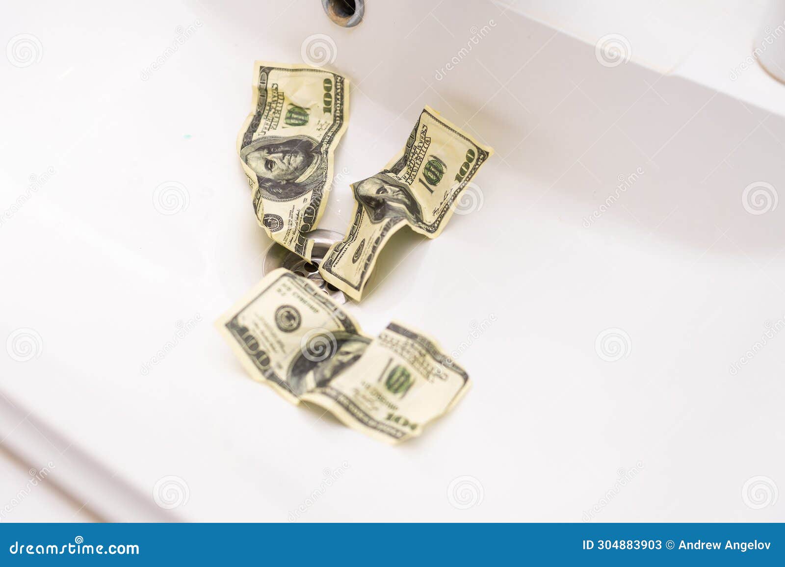 Cash Money Going Down Sink Drain Isolated on White Background Stock ...