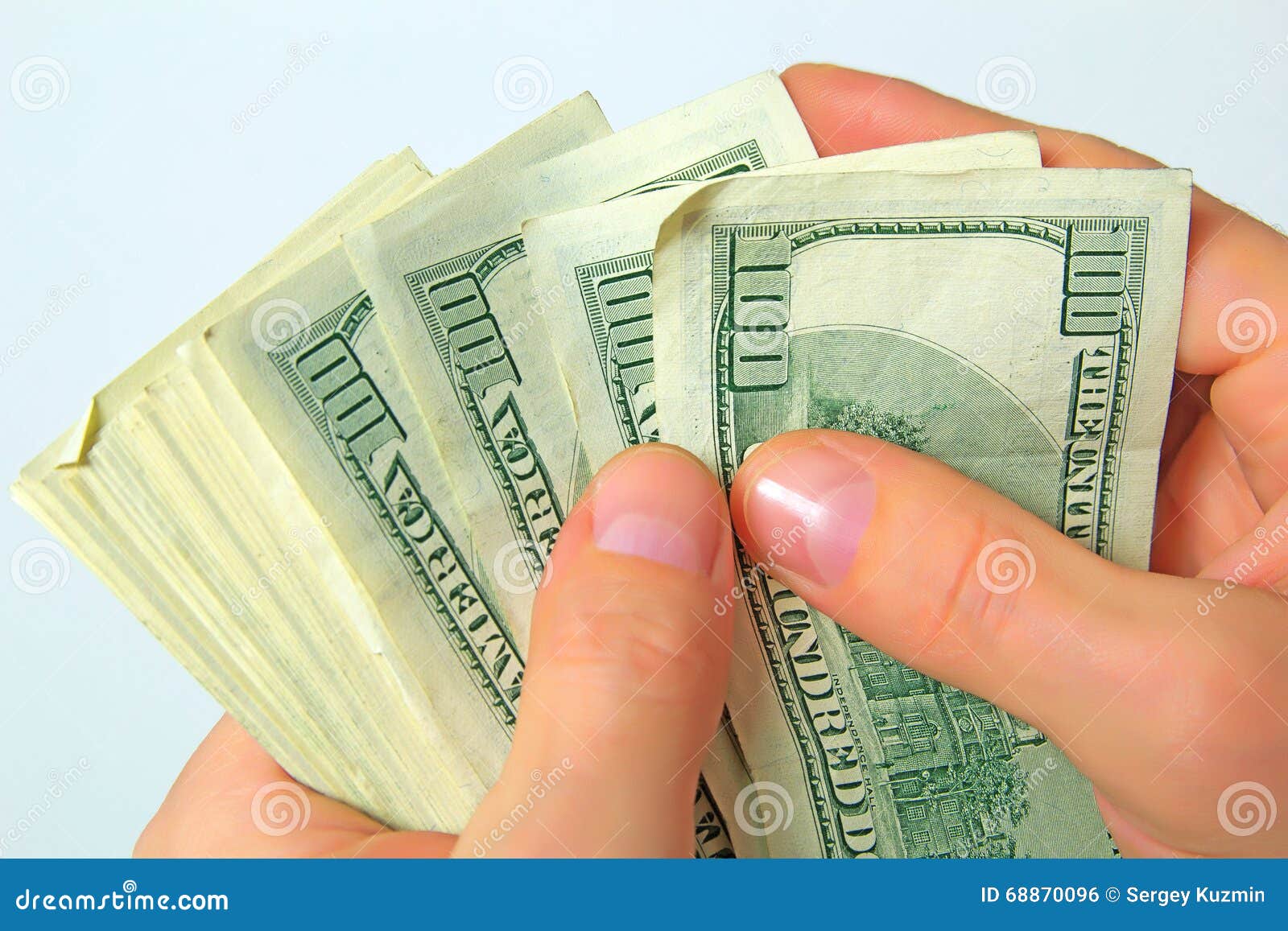 Cash US dollars in hand. stock photo. Image of benefits - 68870096
