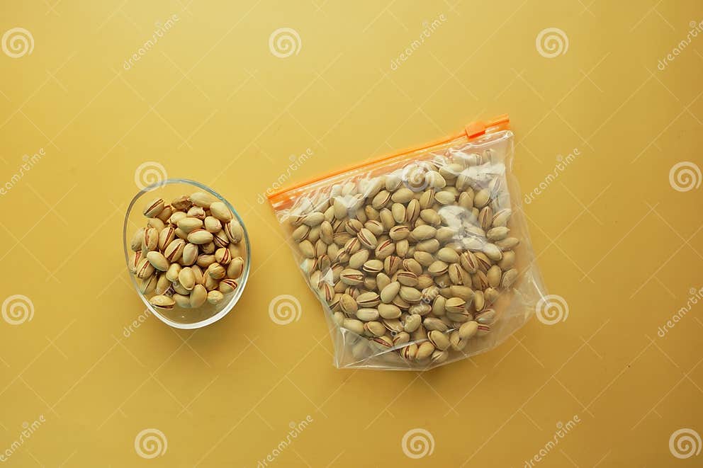 Cashew Nuts in a Plastic Packet on Color Background Stock Photo - Image ...