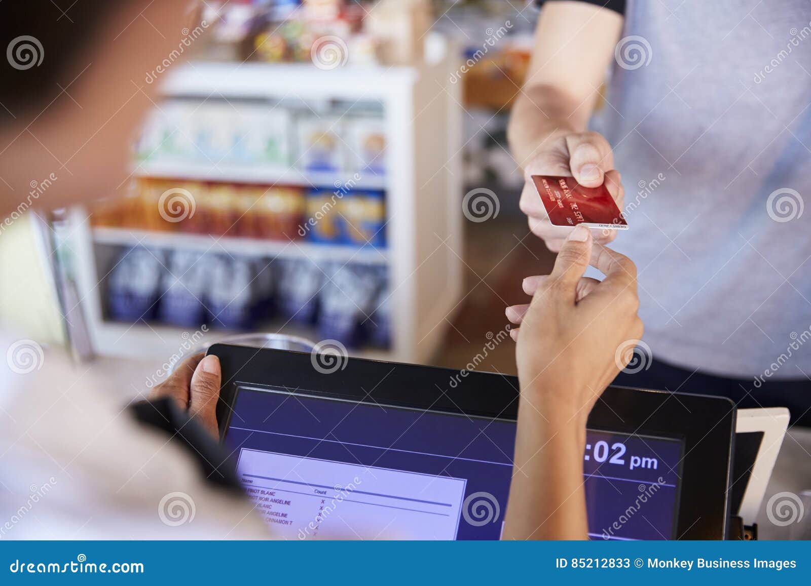 Cashier Accepts Card Payment from Customer in Delicatessen Stock Image ...