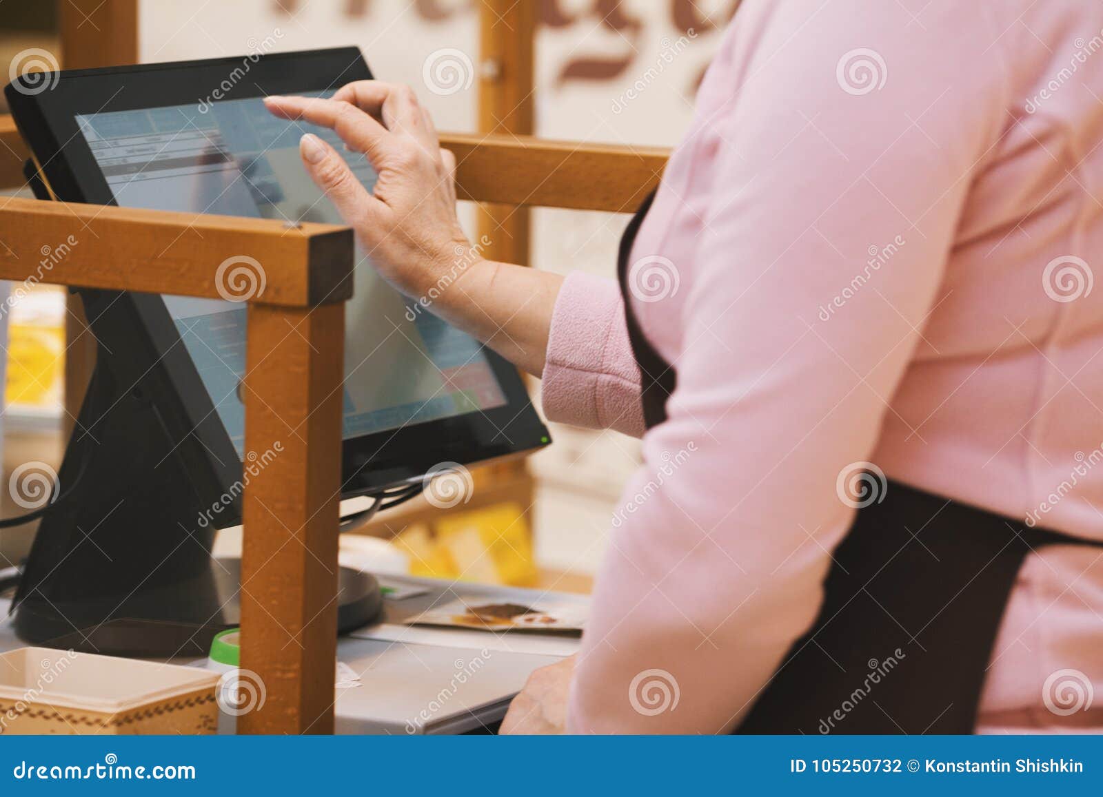 The cashier at the bakery stock photo. Image of cashier - 105250732