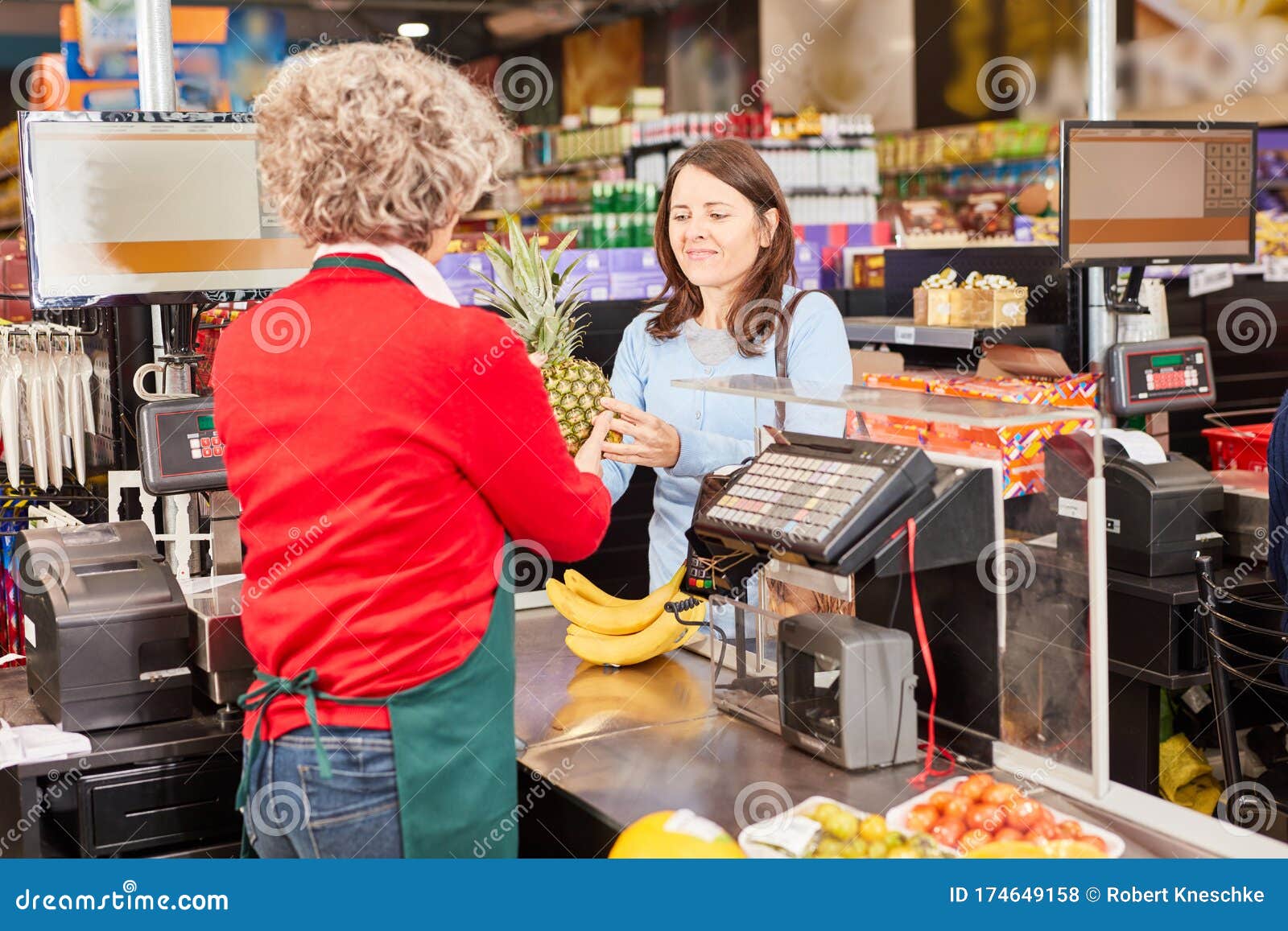 Cashier and Customer with Fruit at Checkout Stock Photo - Image of cash ...