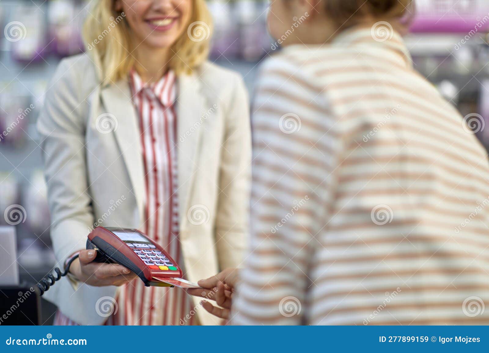Cashier Processing a Credit Card Paymen for a Customer Stock Image ...