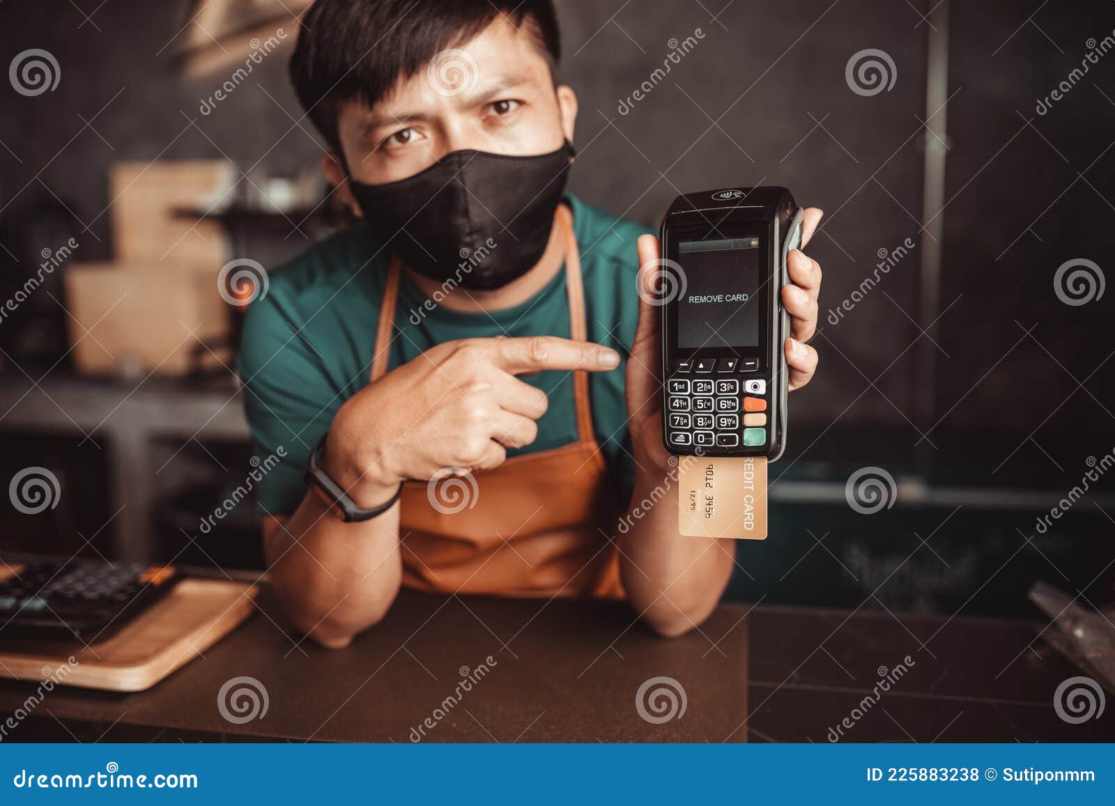Cashier Recommends Paying with a Credit Card Machine Stock Photo ...