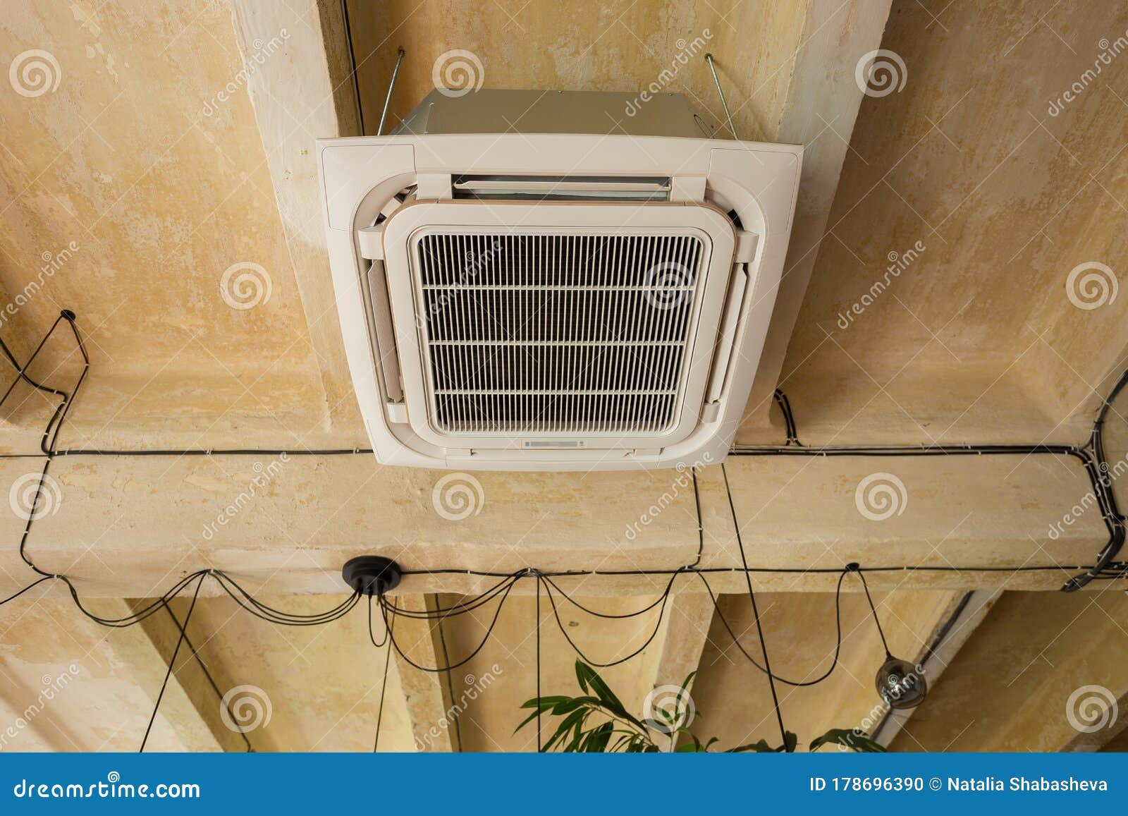 Cassette-type Ceiling Air Conditioning on Beige Ceiling Grunge Stock ...