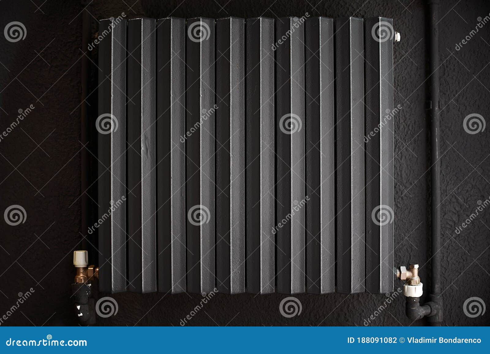 Cast Iron Radiator Heater for Home. Black Heating Battery on the Black ...