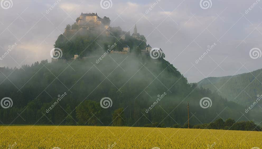 Castle in Morning Mist stock image. Image of hochosterwitz - 10256981