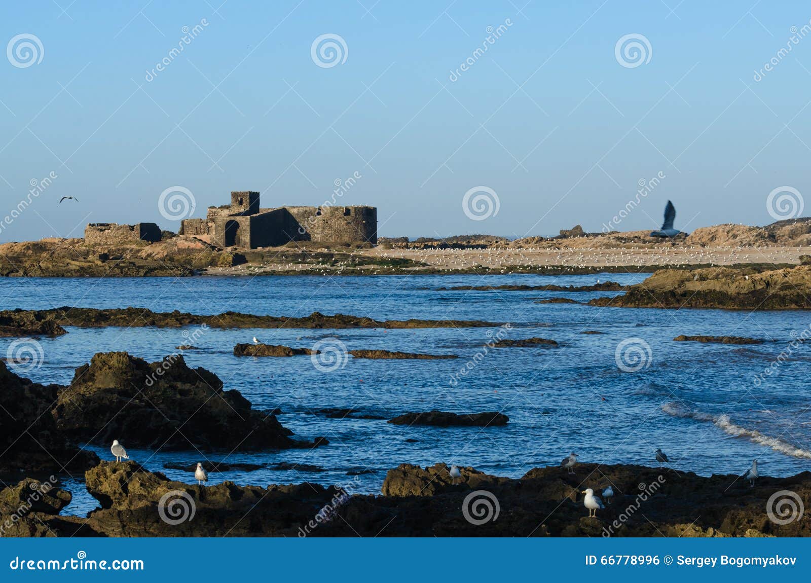 Castle in the Ocean at Sunset Stock Photo - Image of building, atlantic ...