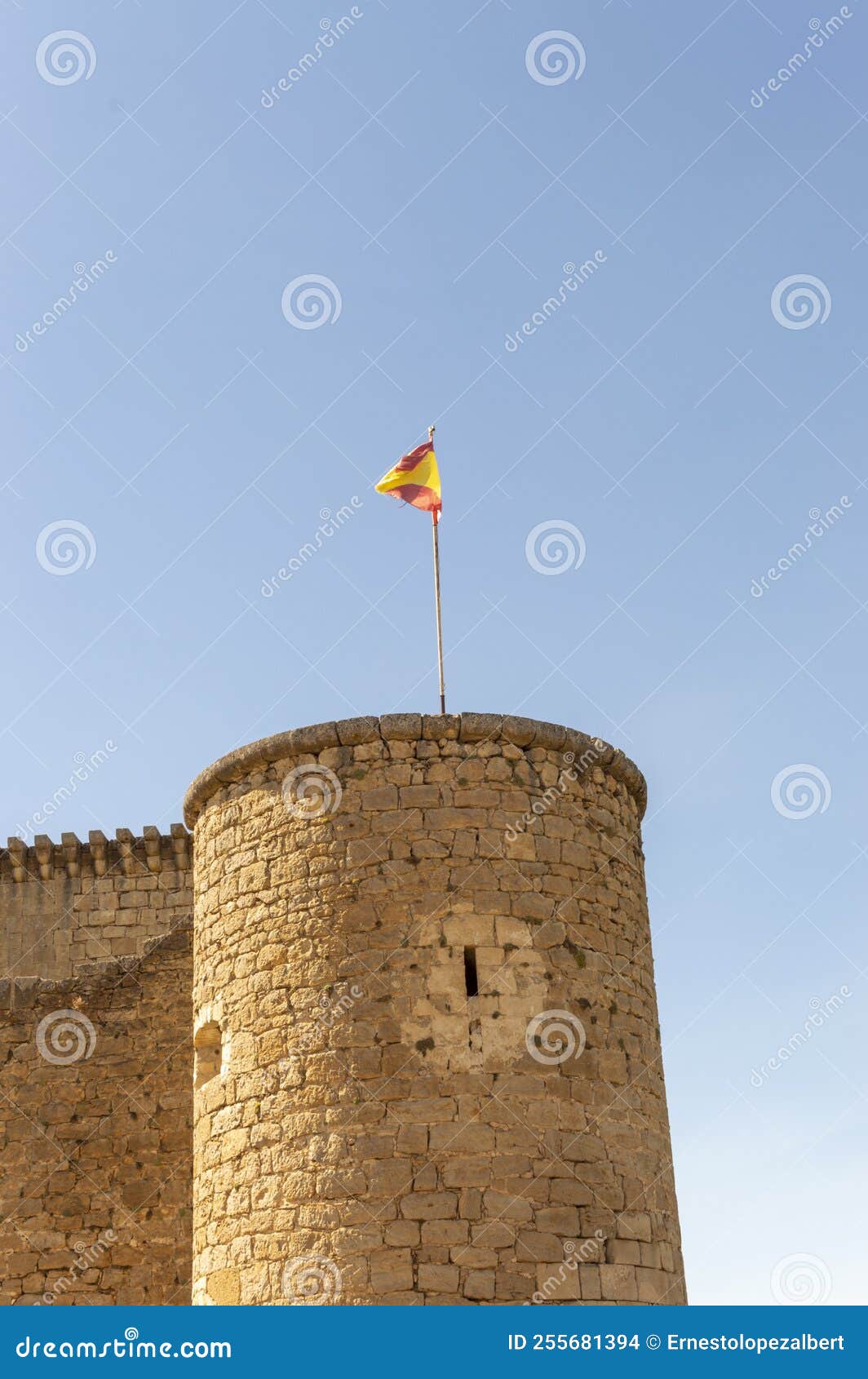 Castle Tower Built with Stone Blocks and the Spanish Flag Flying at the ...