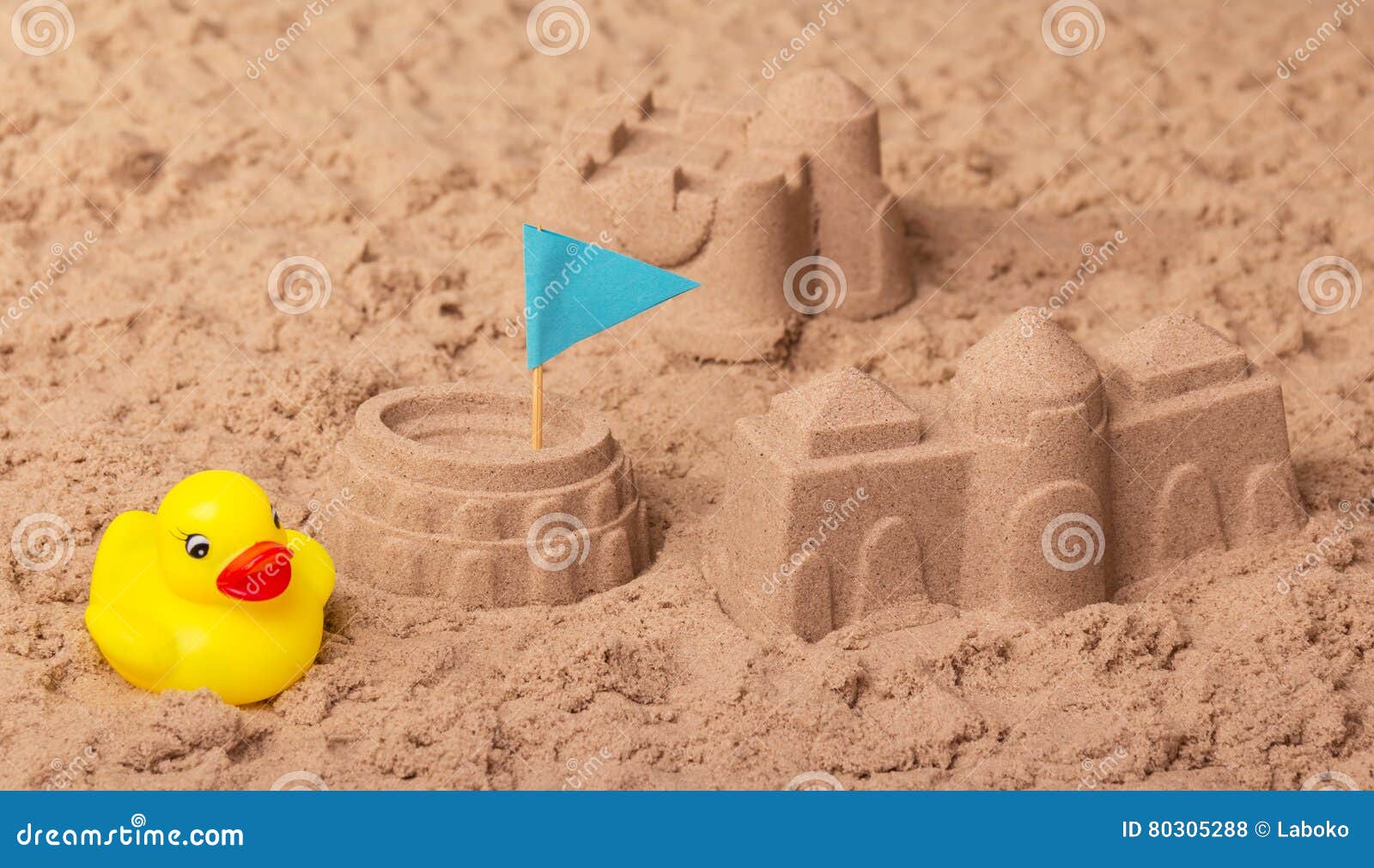 Castles and Coliseum with Flag, Rubber Duck in Sand. Stock Photo ...