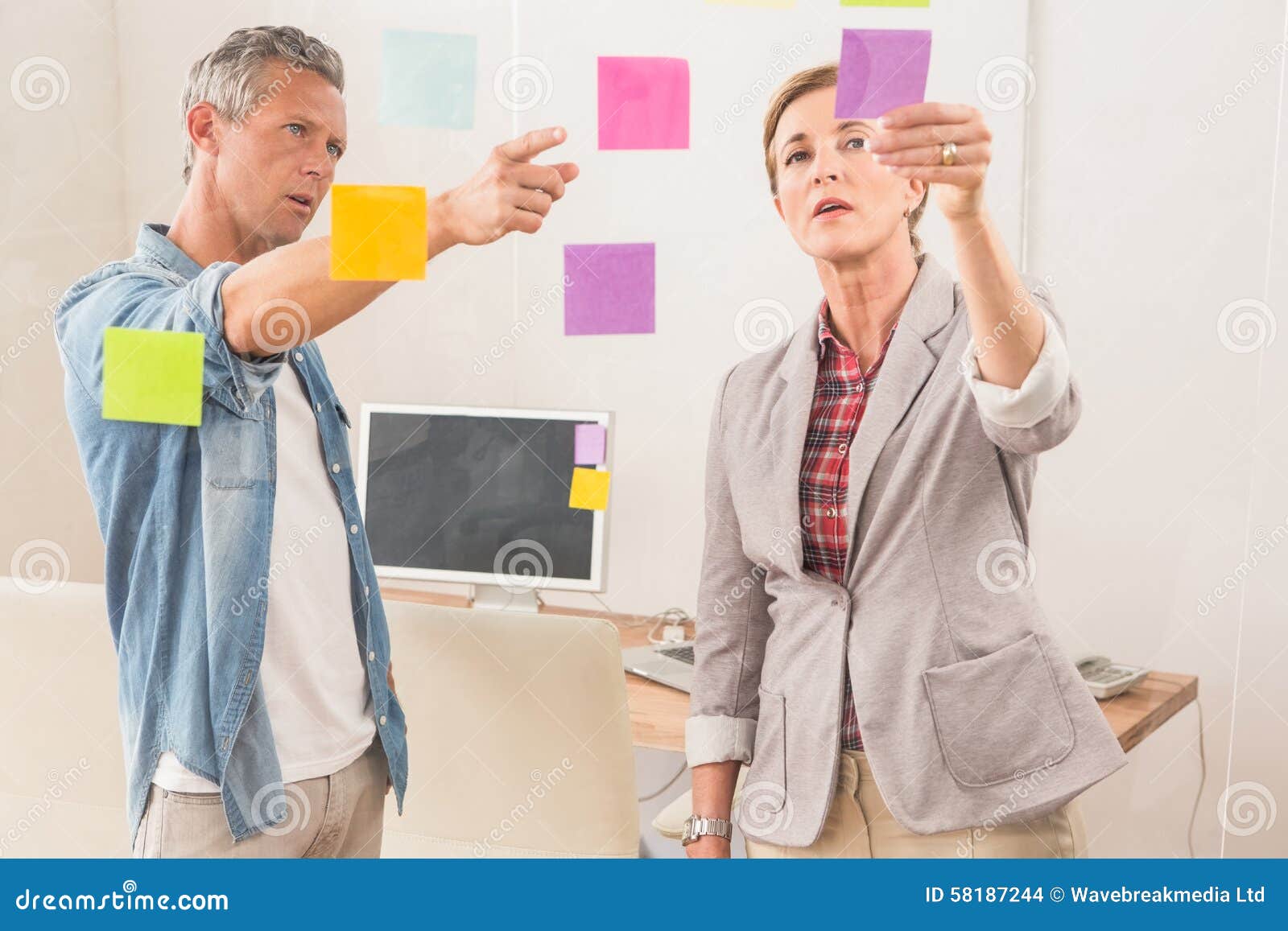 Casual Business Colleagues Working with Sticky Notes Stock Photo ...
