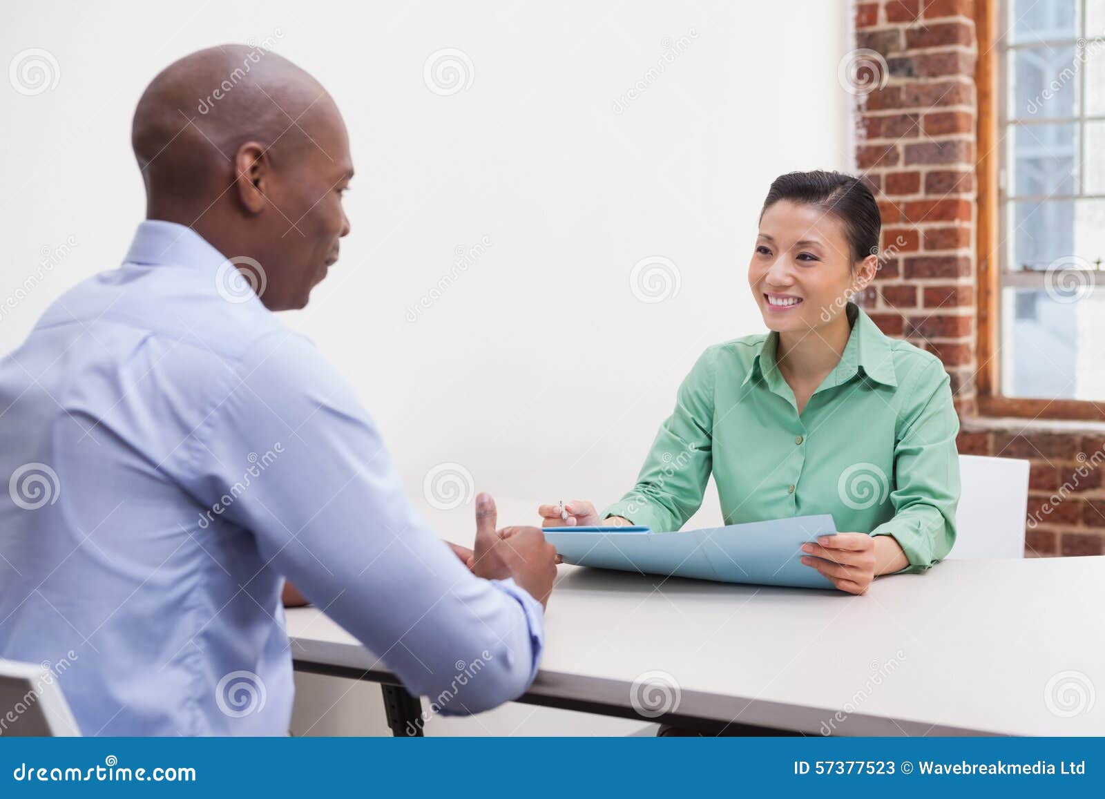 Casual Business People Talking at Desk Stock Image - Image of male ...