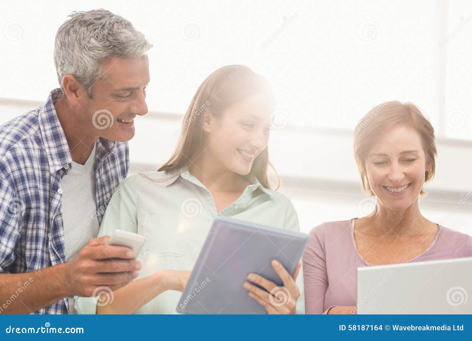 Casual Business People Using Electronic Devices Stock Photo - Image of ...