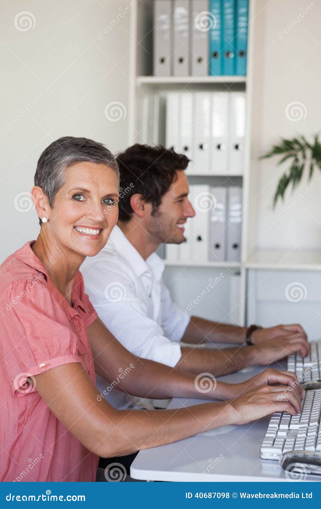 Casual Business Team Working at Desk Using Computers Stock Photo ...