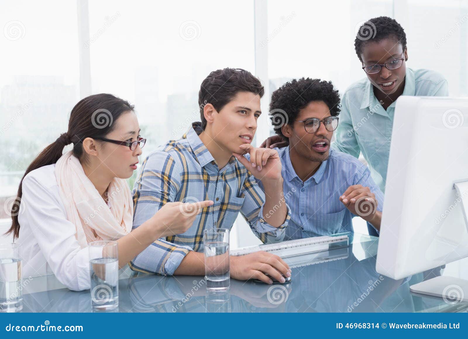 Casual Business Team Working Together at Desk Stock Photo - Image of ...