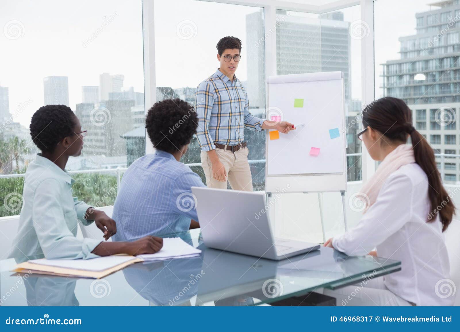 Casual Business Team Working Together at Desk Stock Image - Image of ...