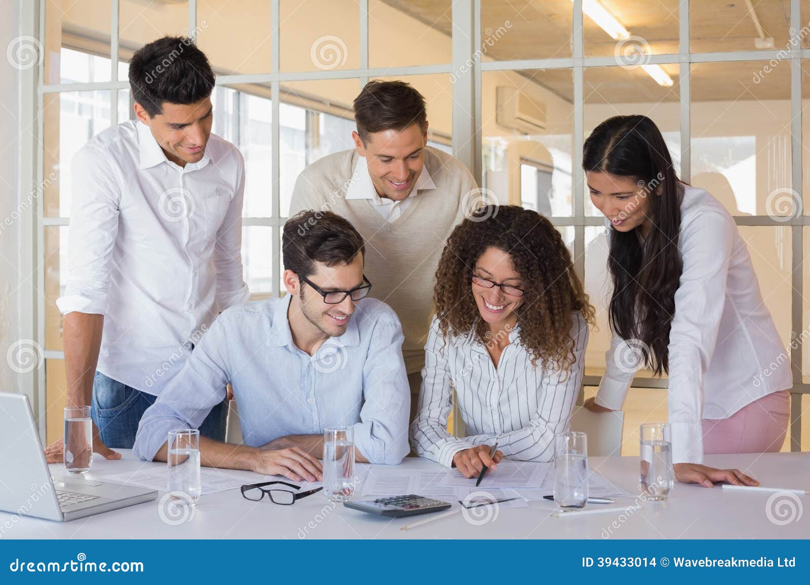 Casual Business Team Working Together at Desk Stock Photo - Image of ...