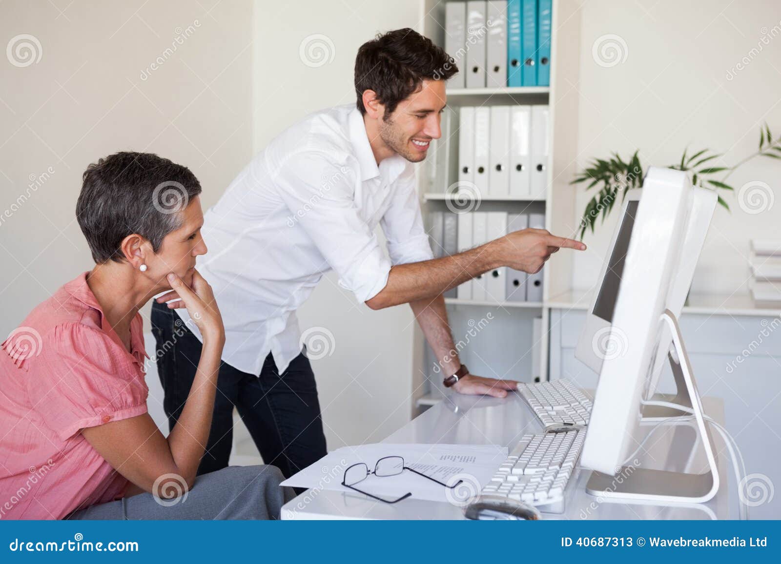 Casual Business Team Working Together at Desk Using Computer Stock ...