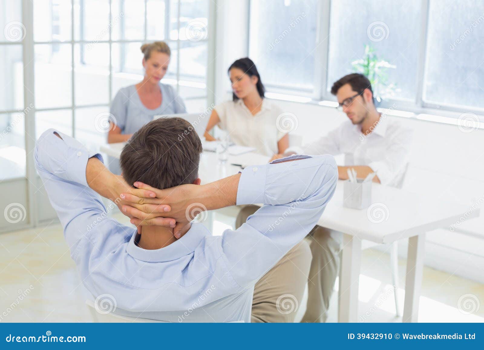 Casual Businessman Leaning Back during a Meeting Stock Photo - Image of ...