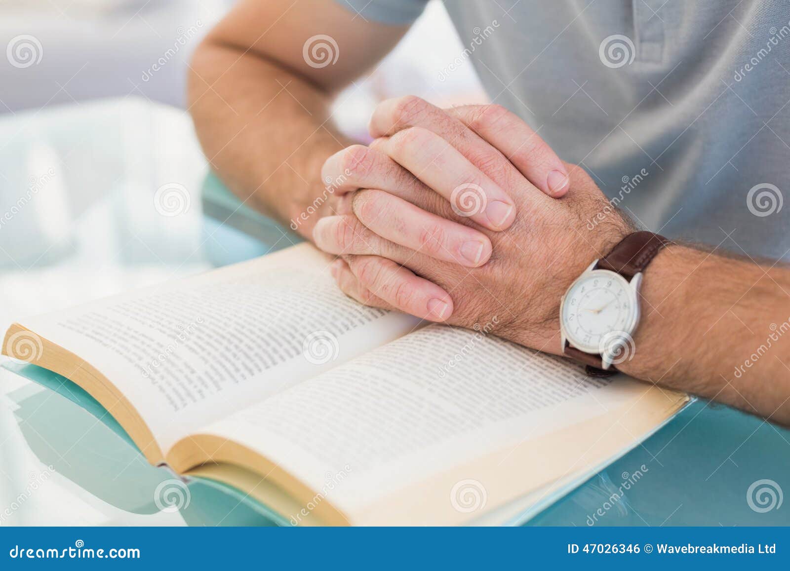 Casual Businessman Sitting at Desk Reading a Book Stock Photo - Image ...