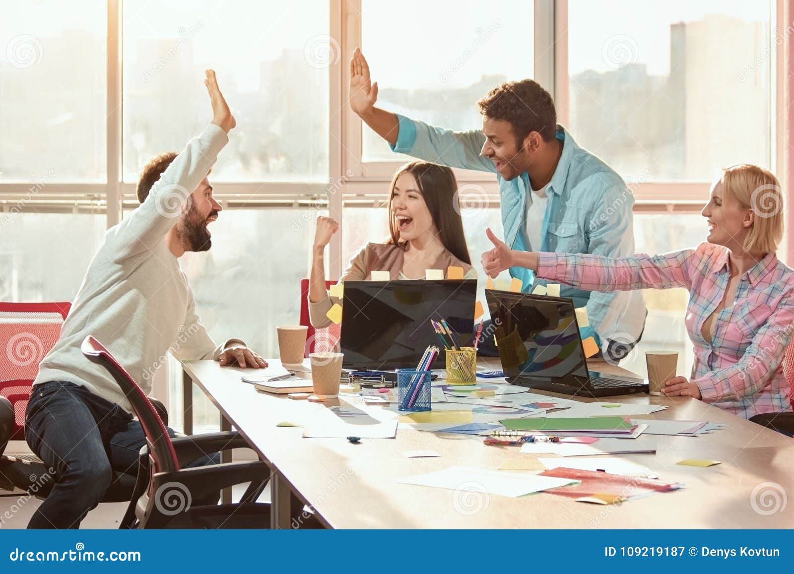 Casual Colleagues Doing High-five in the Office. Stock Image - Image of ...